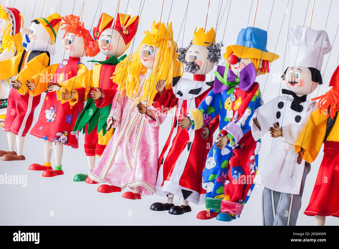The raw of different puppets isolated on white Stock Photo - Alamy