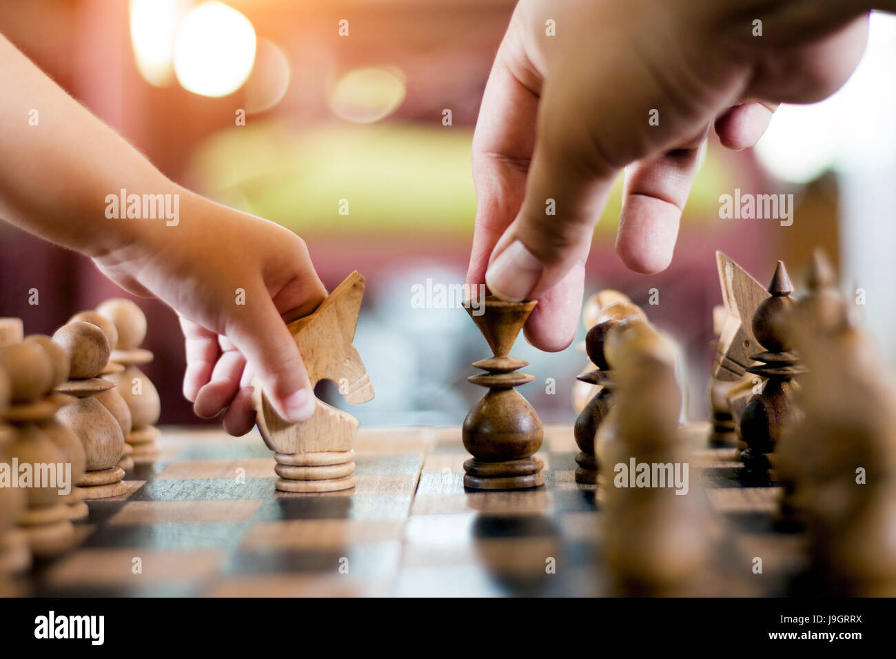 Boy playing chess with his dad hi-res stock photography and images - Alamy