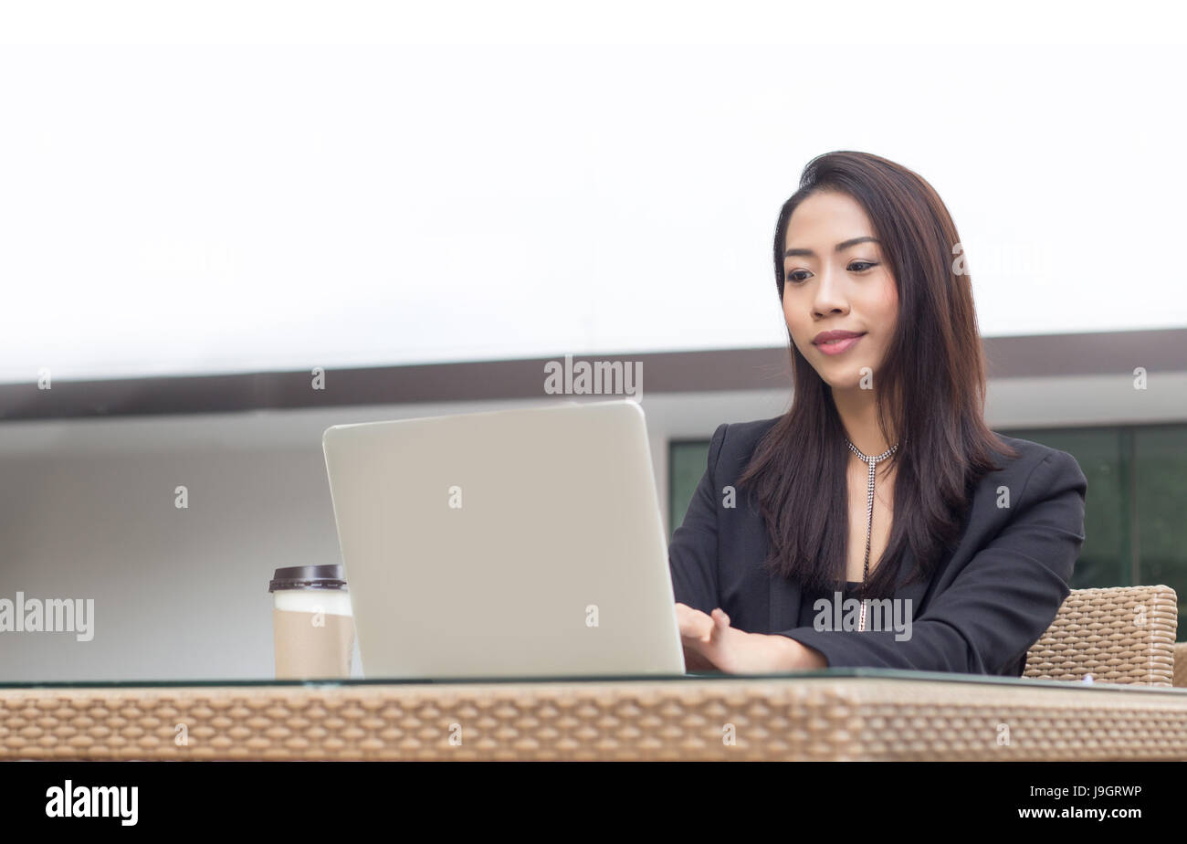 entrepreneur businesswoman asian lady busy day with laptop in outdoor ...
