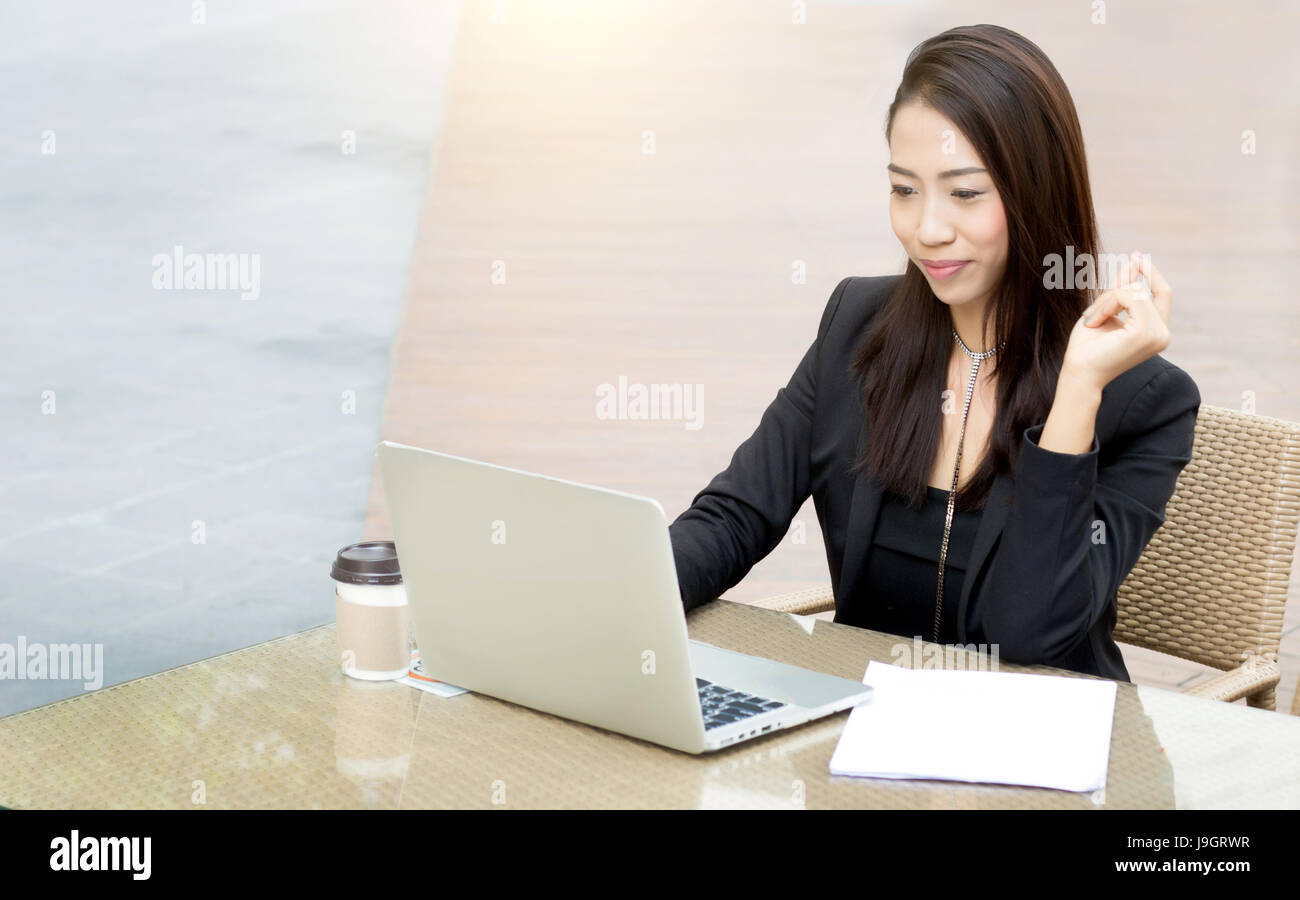 entrepreneur businesswoman asian lady busy day with laptop in outdoor ...