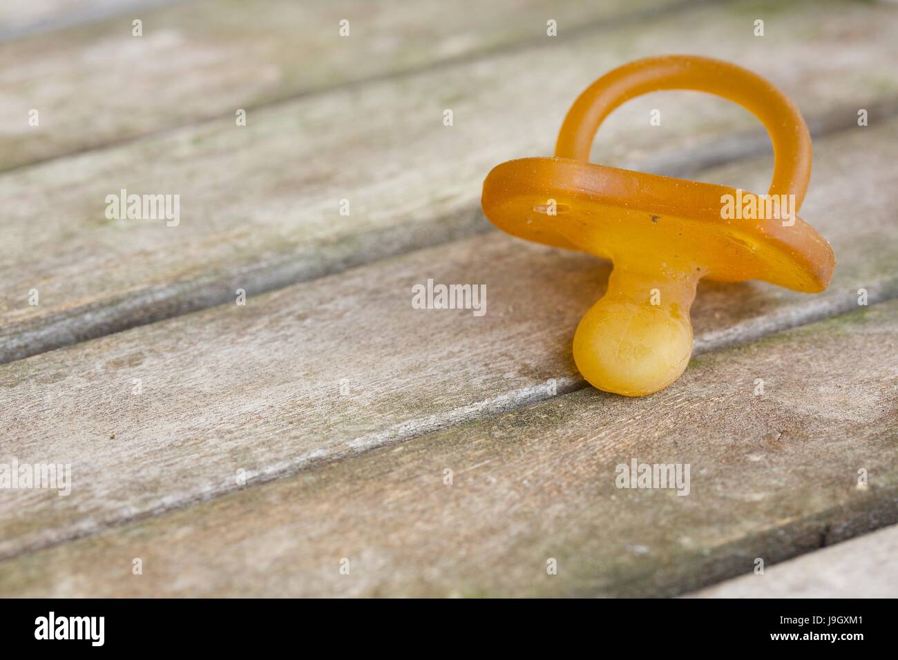 Dirty rubber pacifier lost by someone. Closeup Stock Photo - Alamy