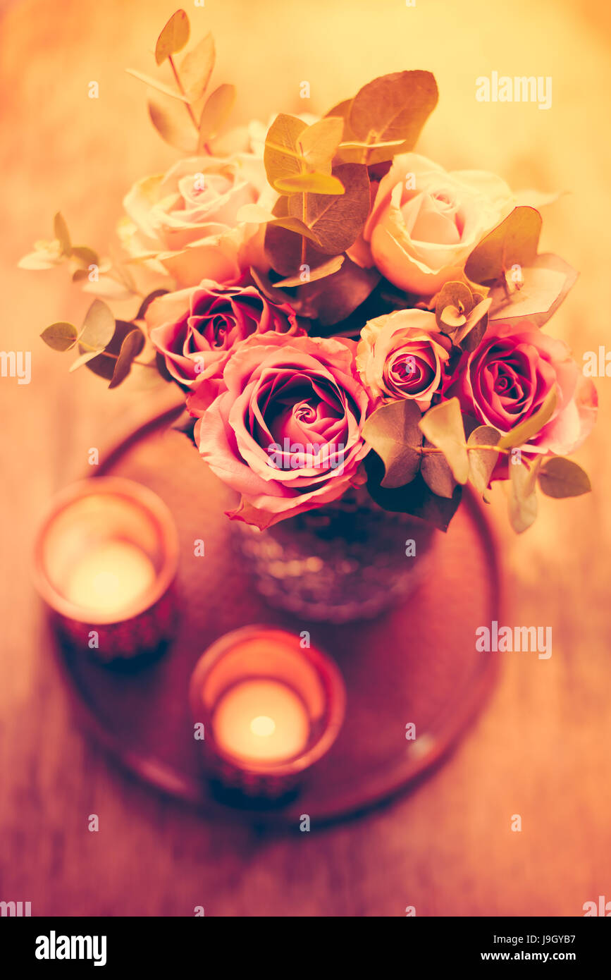 Pastel purple, mauve color fresh summer roses in vase with white wall ...