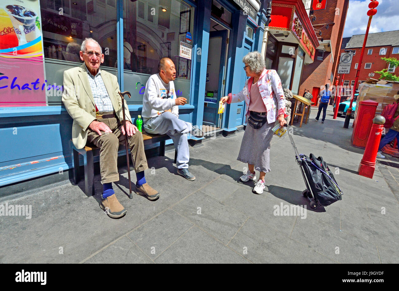 London, England, UK. Chinatown - elderly people talking in Gerrard ...