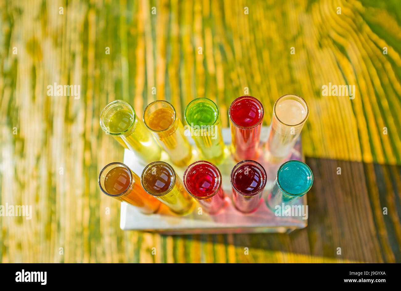 The test tubes with alcohol spirits on the old wooden background, Lviv ...