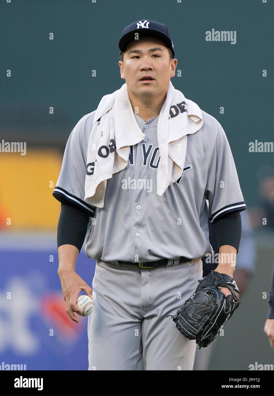 New York Yankees starting pitcher Masahiro Tanaka (19) walks to the ...