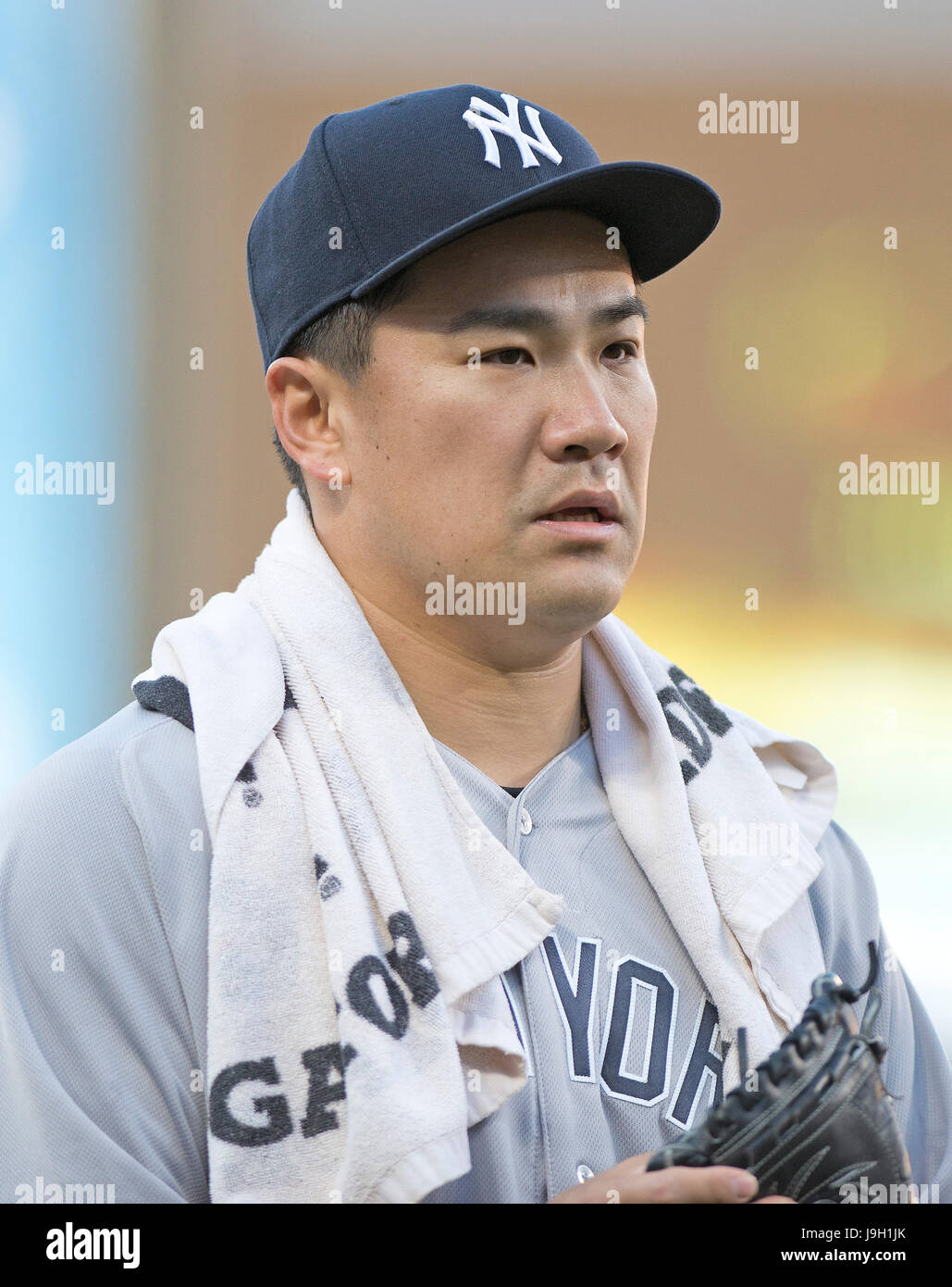 New York Yankees starting pitcher Masahiro Tanaka (19) walks to the ...