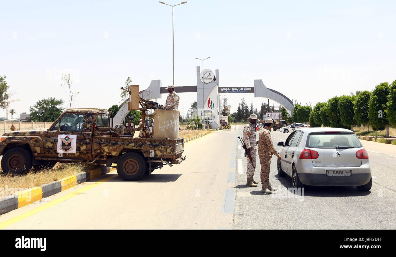 Tripoli, Libya. 1st June, 2017. Security force members check a vehicle ...