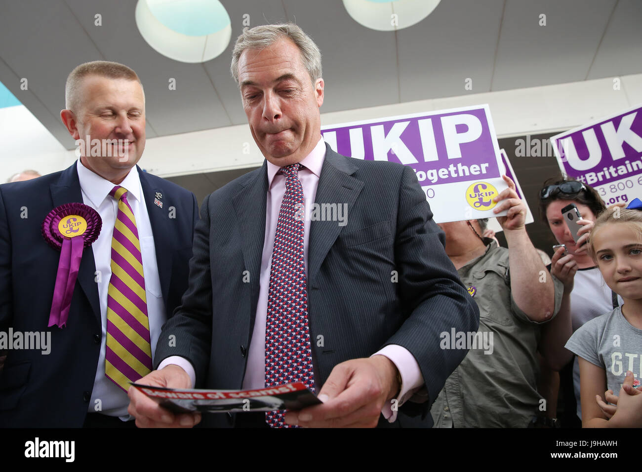 London, UK. 2nd June, 2017. Nigel Farage looks at the leaflet. Former ...