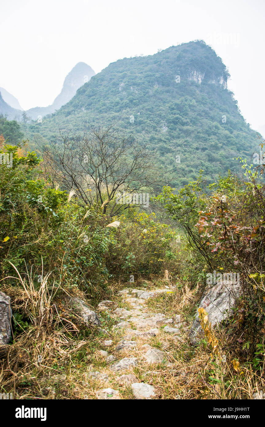 The ancient stone path in the mountain Stock Photo - Alamy