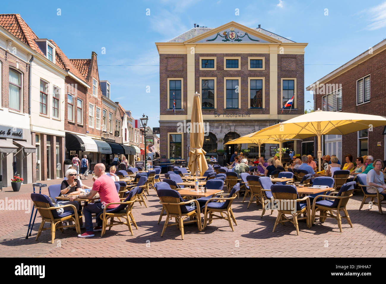 People at outdoor terrace of cafes on Markt Square in old town of ...