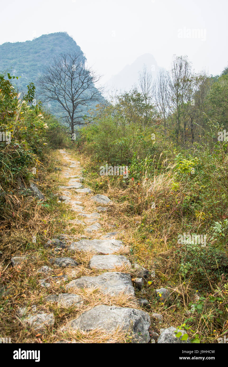 The ancient stone path in the mountain Stock Photo - Alamy