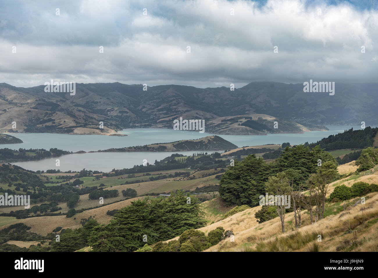Akaroa, New Zealand - March 14, 2017: Akaroa Sound is inlet from ...