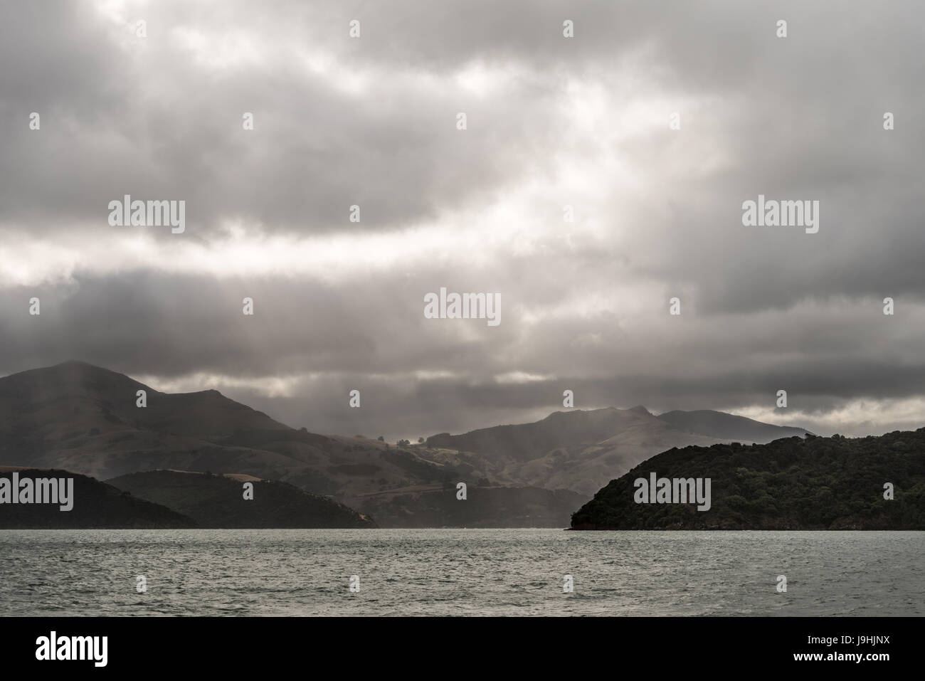 Akaroa, New Zealand - March 14, 2017: Akaroa Sound is inlet from ...