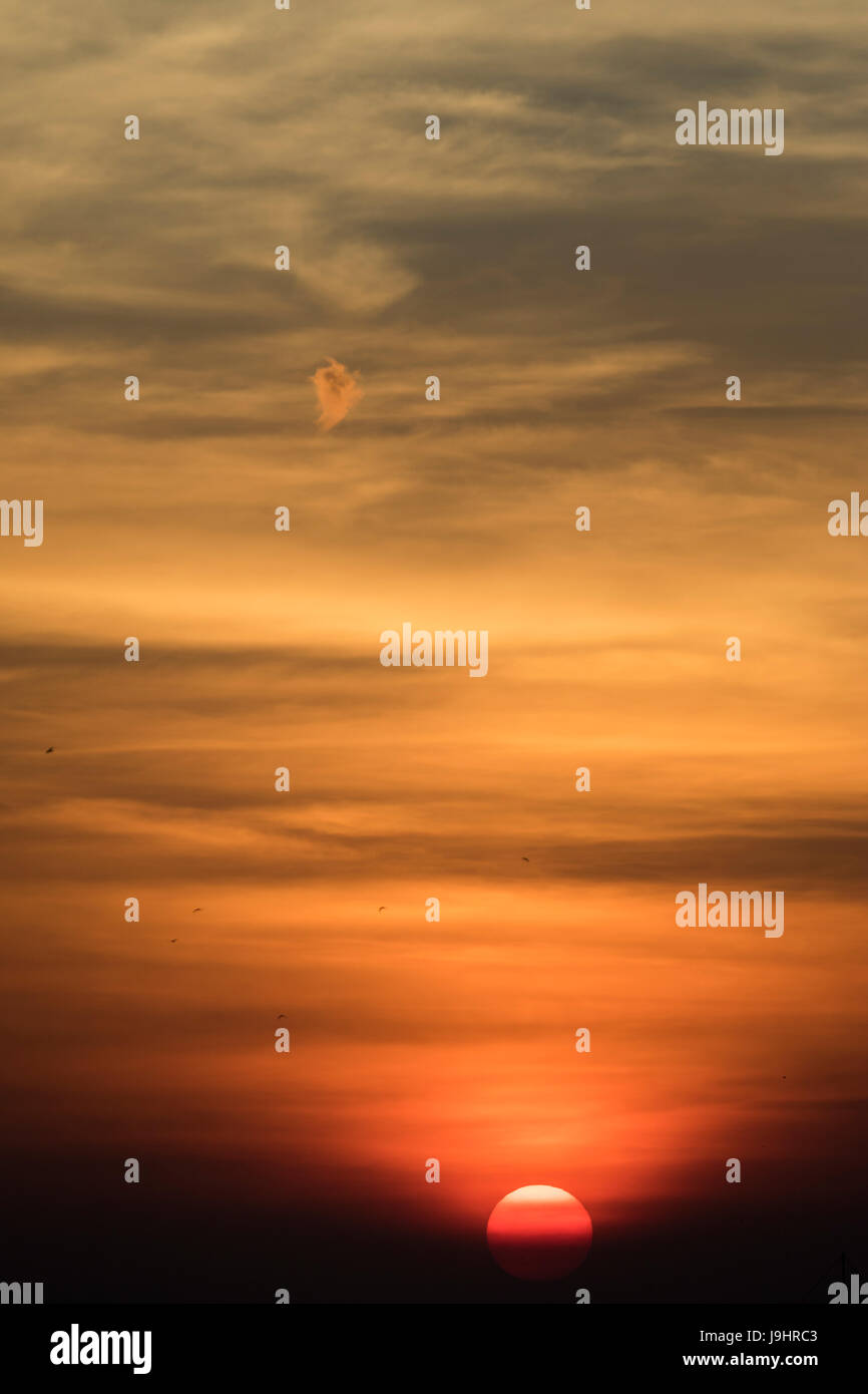 Beautiful sunset painting the sky Stock Photo - Alamy