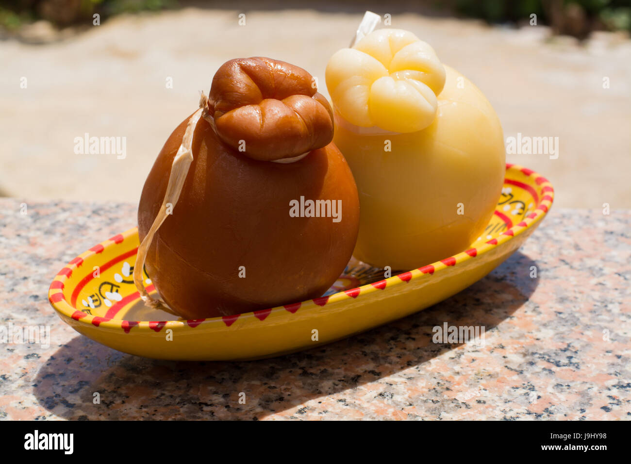 Traditional Italian hard cheese Provolone of Caciocavallo, white and ...