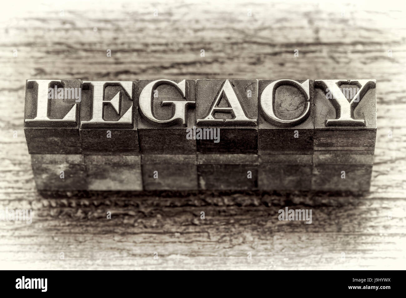 legacy word in mixed vintage metal type printing blocks over grunge ...