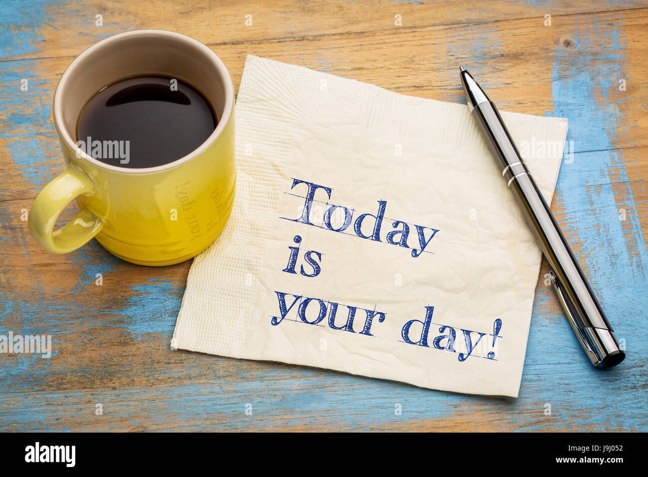 Today is your day - motivational handwriting on a napkin with a cup of ...