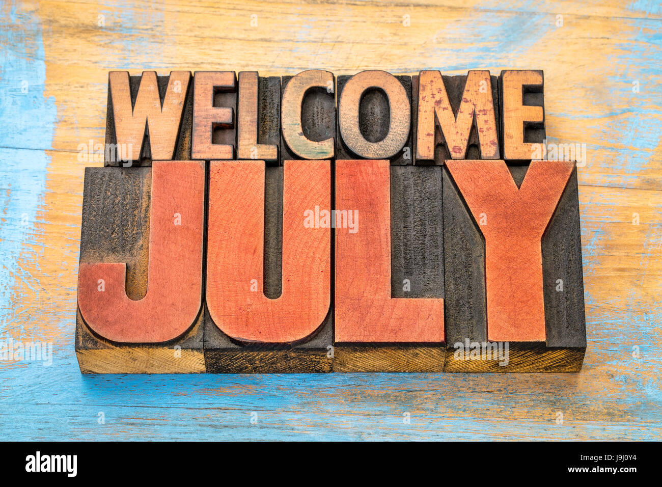 Welcome July banner - word abstract in vintage letterpress wood type ...