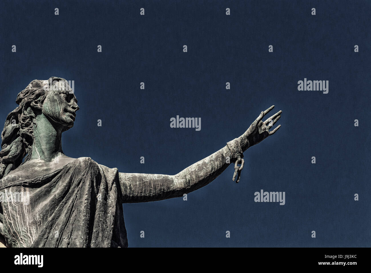 broken chain on the wrist of hand of female statue upwards raised in ...