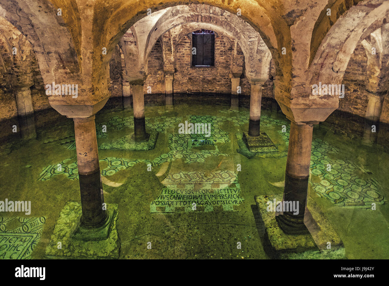 waterlogged crypt below sea level with mosaics, archs and columns Stock ...