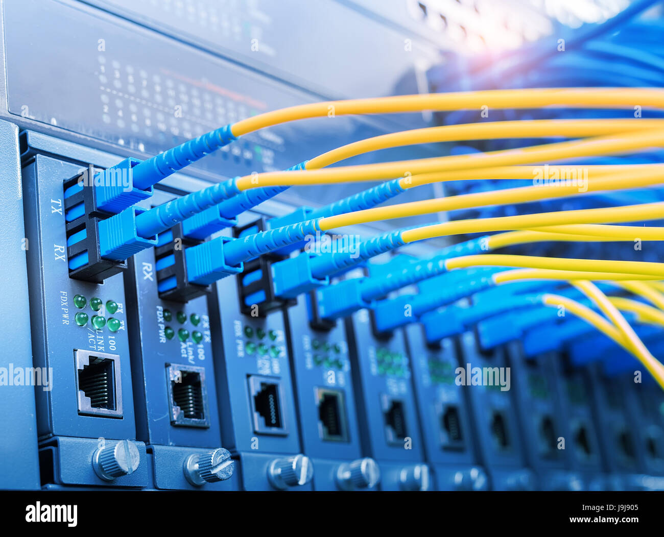 Fiber Optic cables connected to optic ports and UTP, Network cables ...