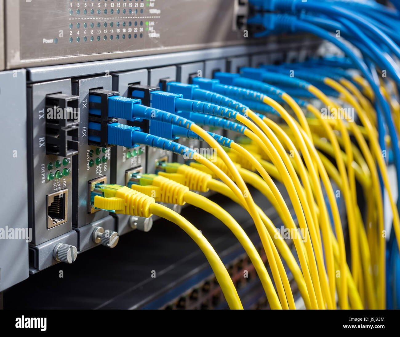 Fiber Optic cables connected to optic ports and UTP, Network cables ...