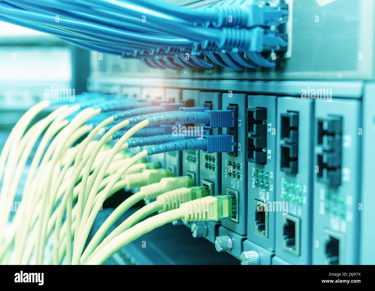 Fiber Optic cables connected to optic ports and UTP, Network cables ...