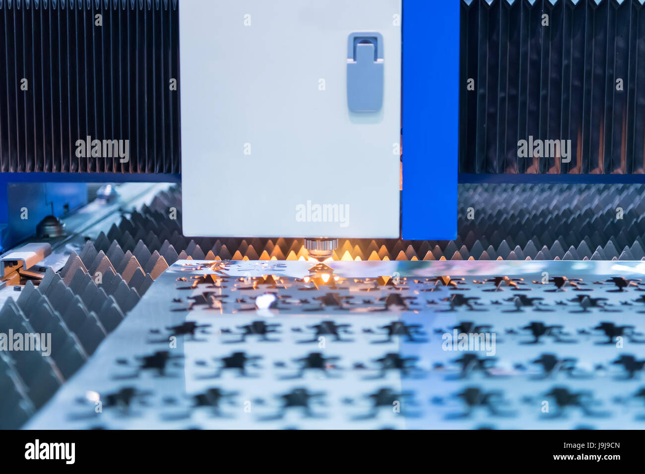 CNC laser cut machine while cutting the sheet metal Stock Photo - Alamy