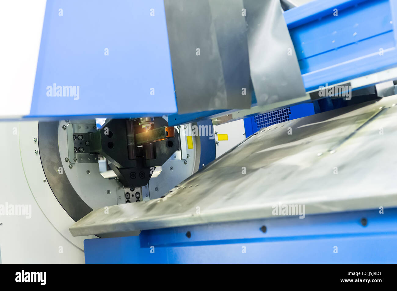 CNC laser cut machine while cutting the sheet metal Stock Photo - Alamy