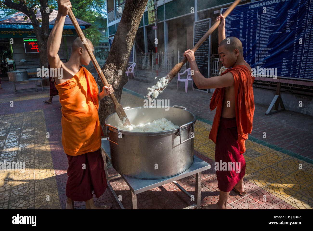 Monks cooking rice hi-res stock photography and images - Alamy