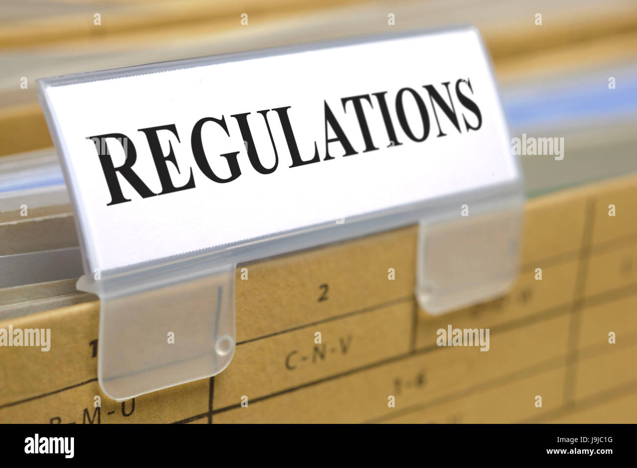 regulations marked on file folder Stock Photo - Alamy