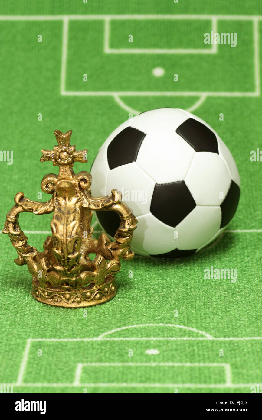 Symbol photo - crown on a soccer field. Shot in studio Stock Photo - Alamy