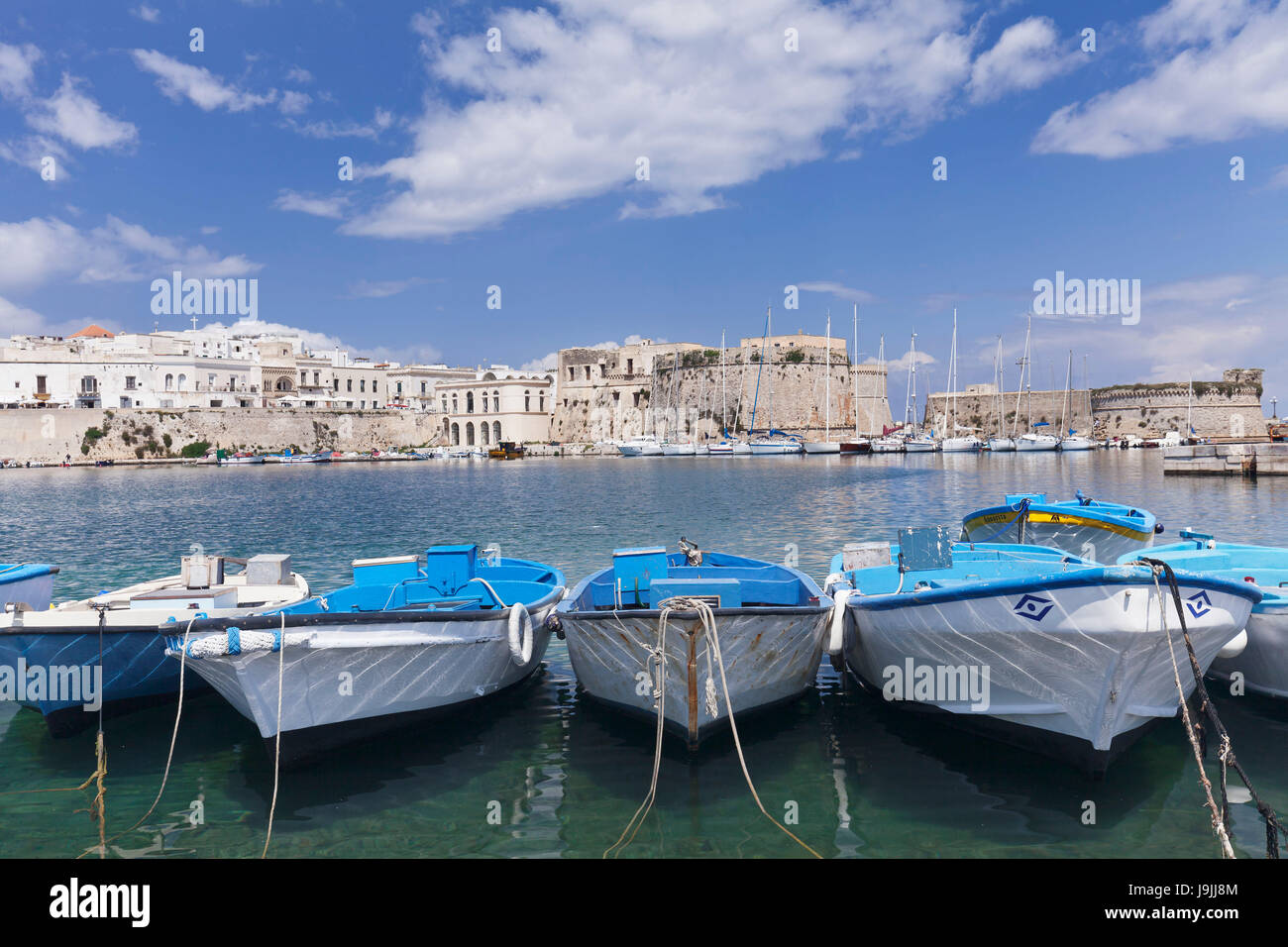 Fishing boats in the harbour with view at the Old Town with fort ...