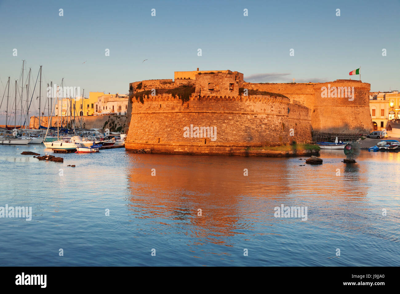 Old Town with fort, city wall and harbour with sunrise, Gallipoli ...
