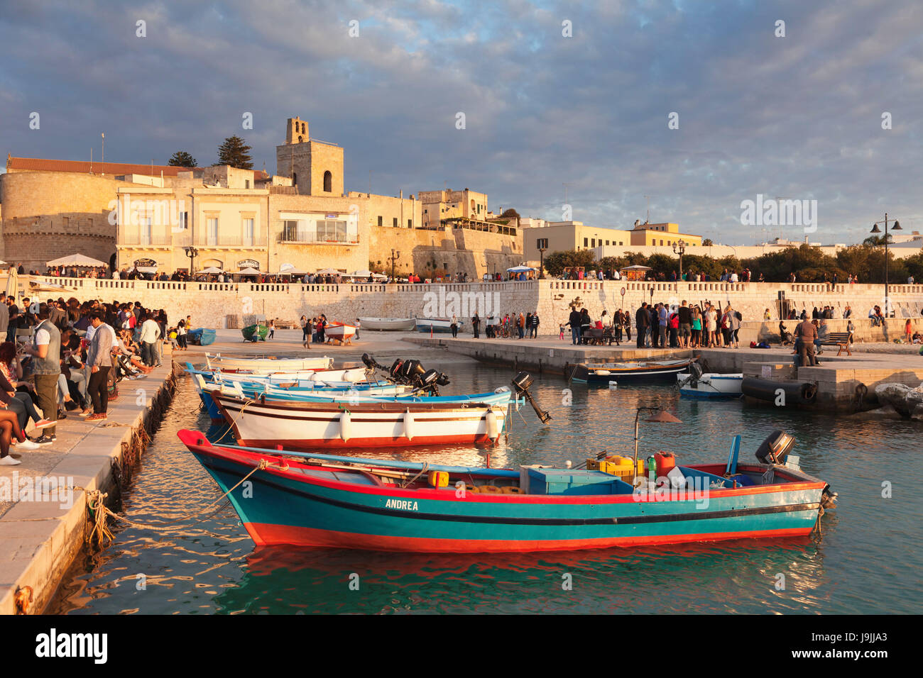 Passeggiata (strolling) in the harbour of Otranto, province of Lecce ...