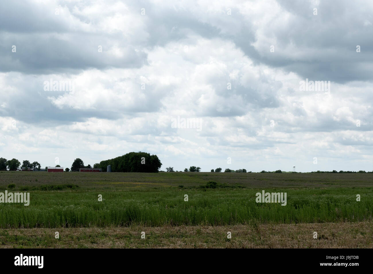 Farm Landscape With Cloudy Sky Stock Photo - Alamy