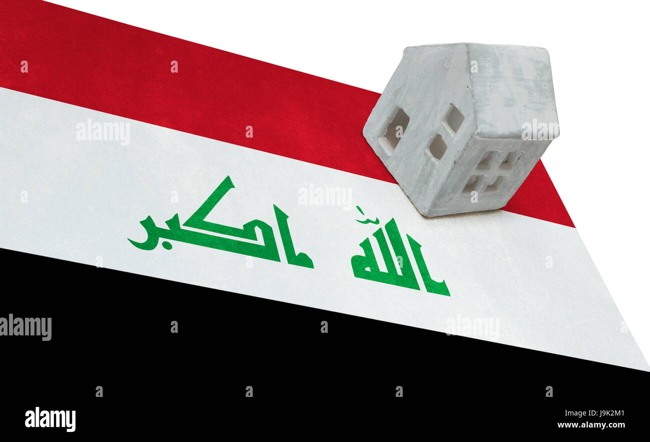 Small house on a flag - Living or migrating to Iraq Stock Photo - Alamy