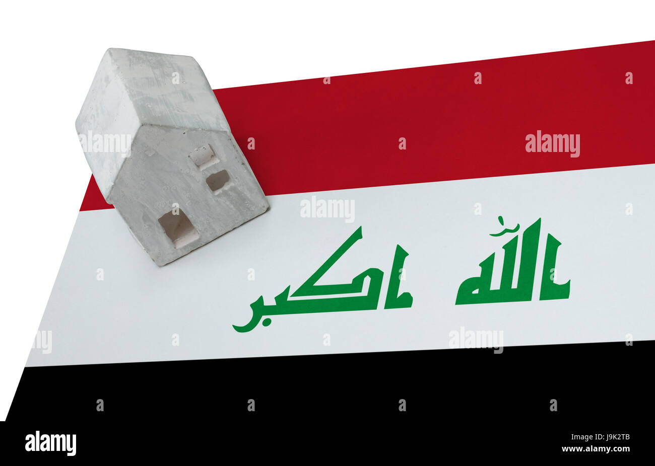 Small house on a flag - Living or migrating to Iraq Stock Photo - Alamy