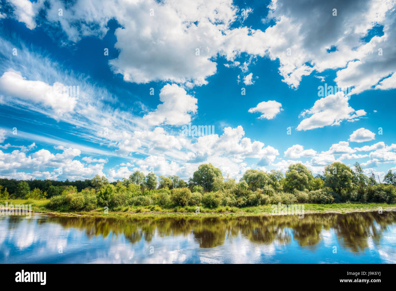 River Landscape With Reflections Of Clouds And Woods In Water. Summer ...