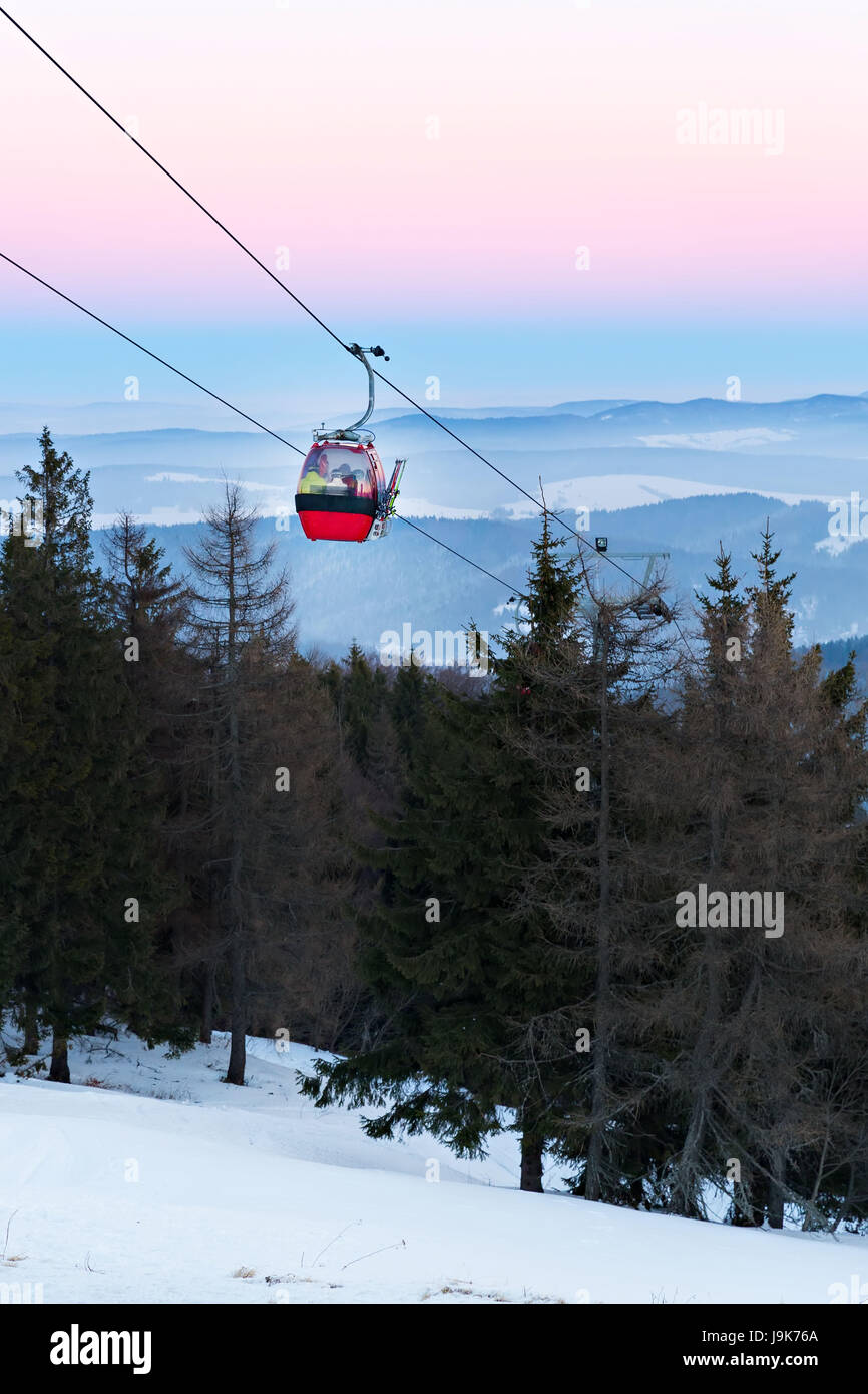 Gondola ski lift in beautiful mountains, winter sunset Stock Photo - Alamy