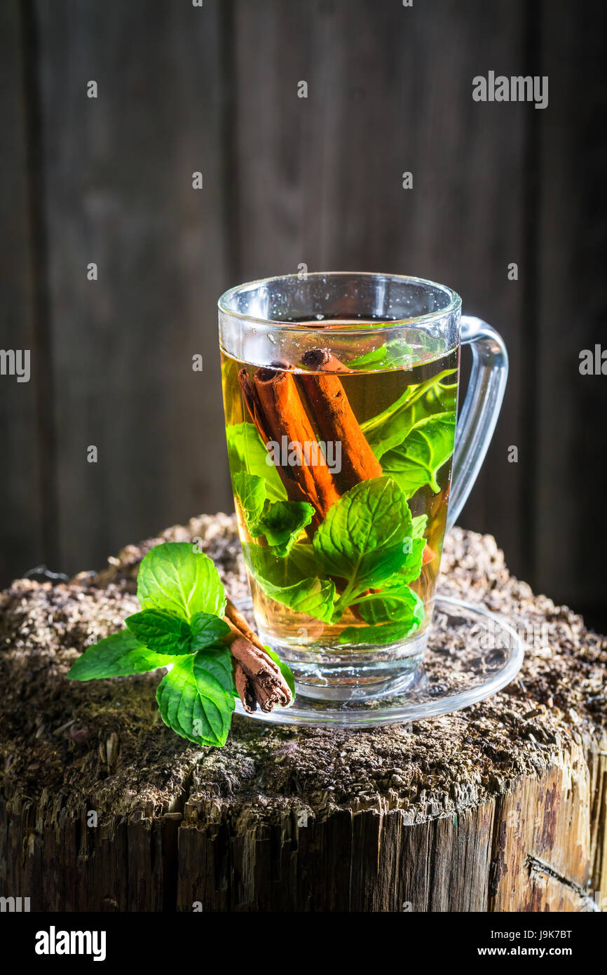 Aromatic tea with green leaves and cinnamon bark Stock Photo - Alamy