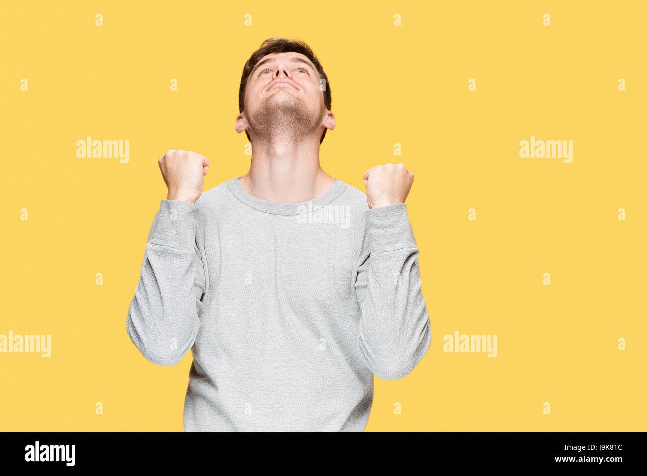 The young man screaming with delight Stock Photo - Alamy