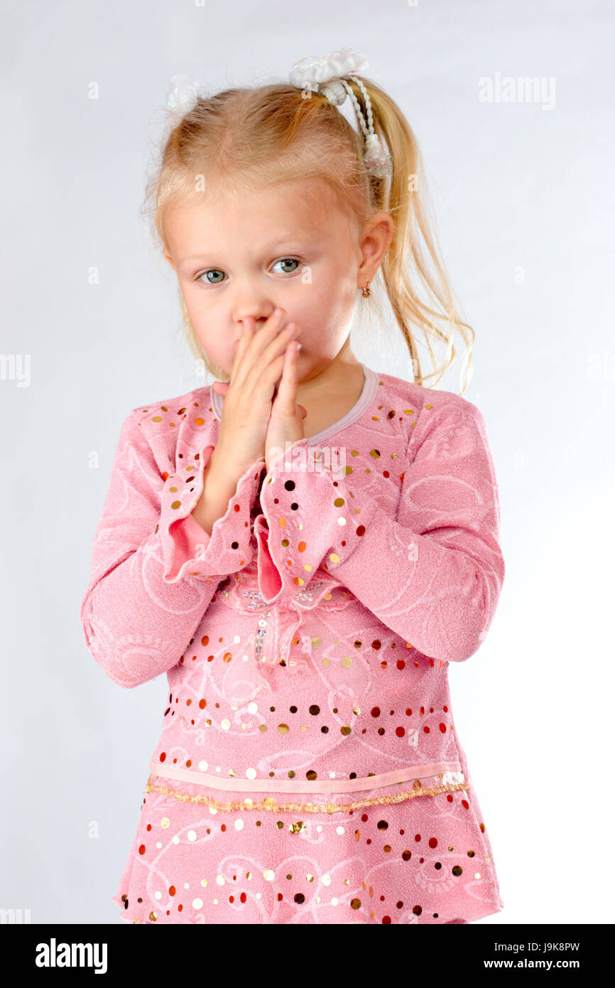 Studio portrait of a curious shy little girl with blond hair Stock ...