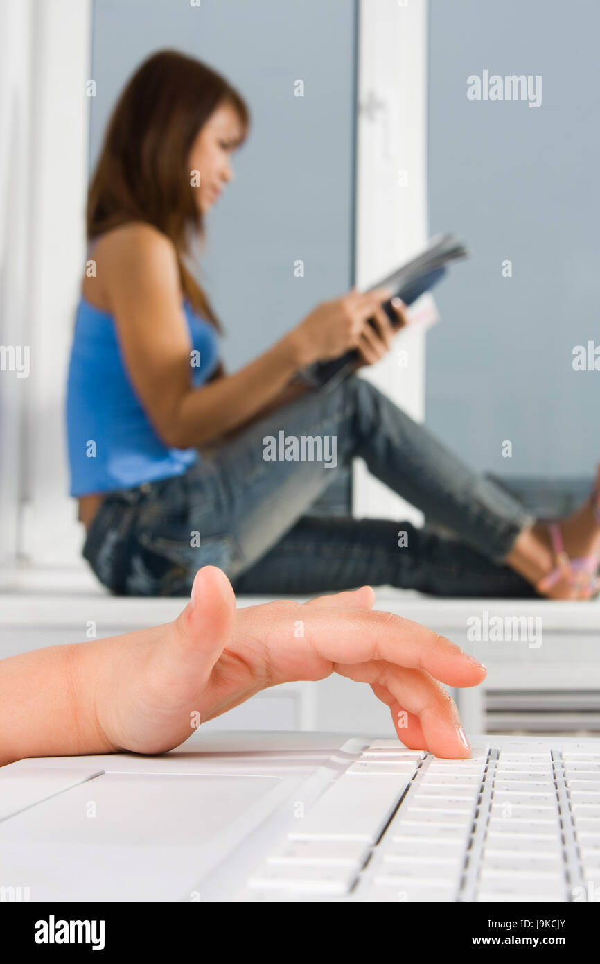 Woman learning laptop pushing button hi-res stock photography and ...