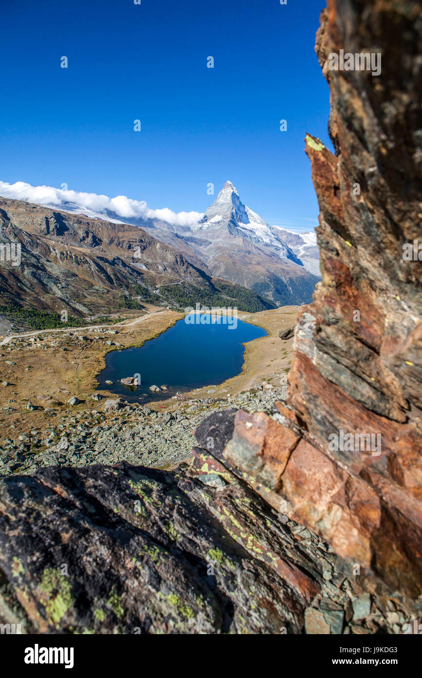 The tip of the Matterhorn is reflected in Stellisee. Zermatt Canton of ...