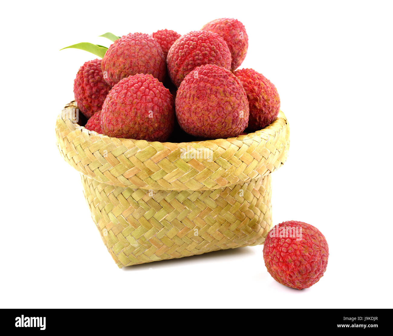 Lychees in a wicker basket on a white background Stock Photo - Alamy