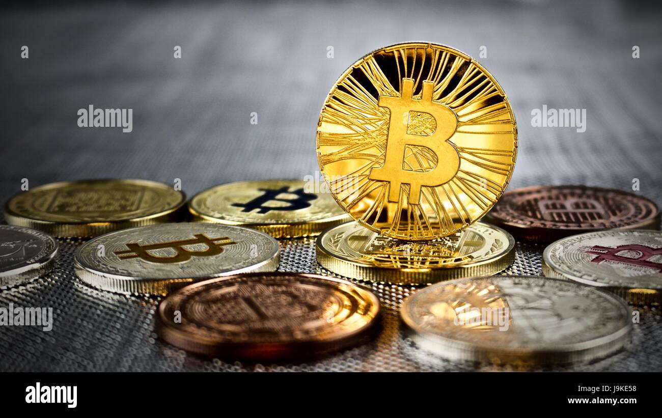 Cryptocurrency physical gold bitcoin coin on bitcoins. Money concept ...