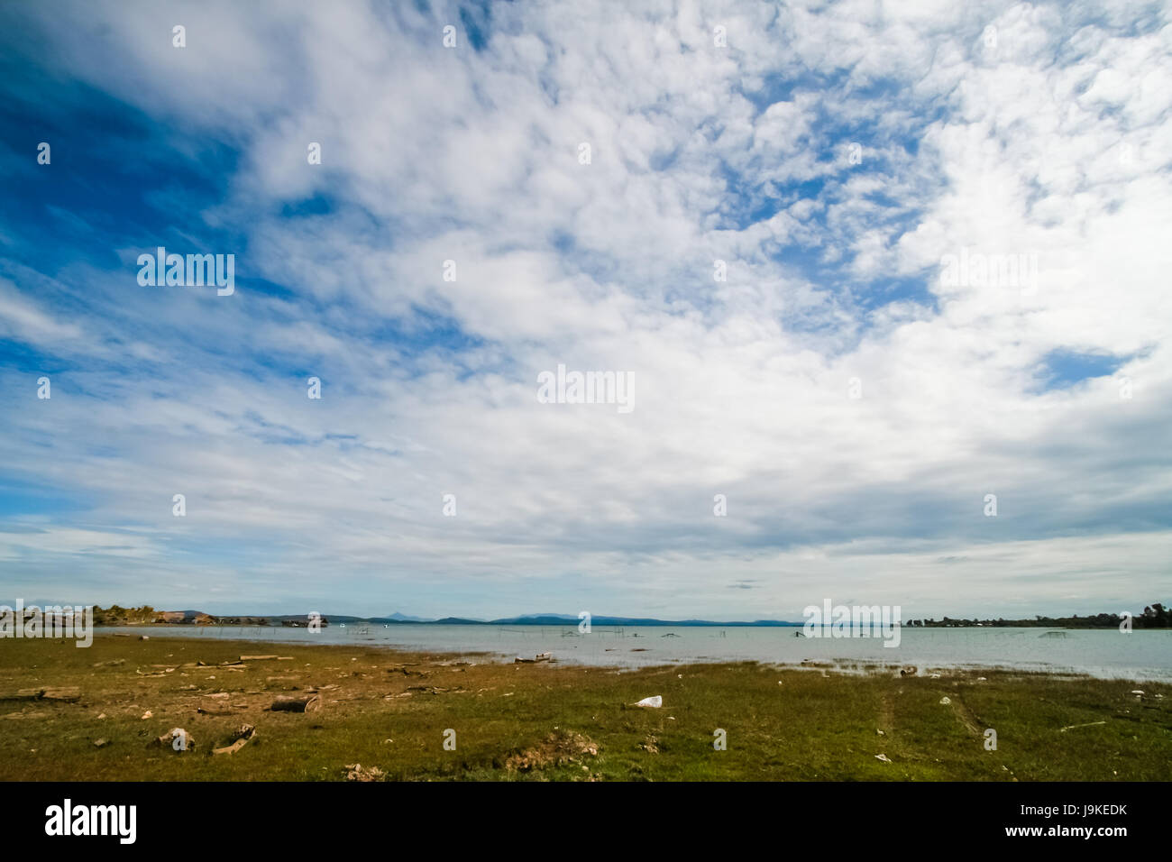 view of twilight sky after sunset in the meadow and lake grassland ...