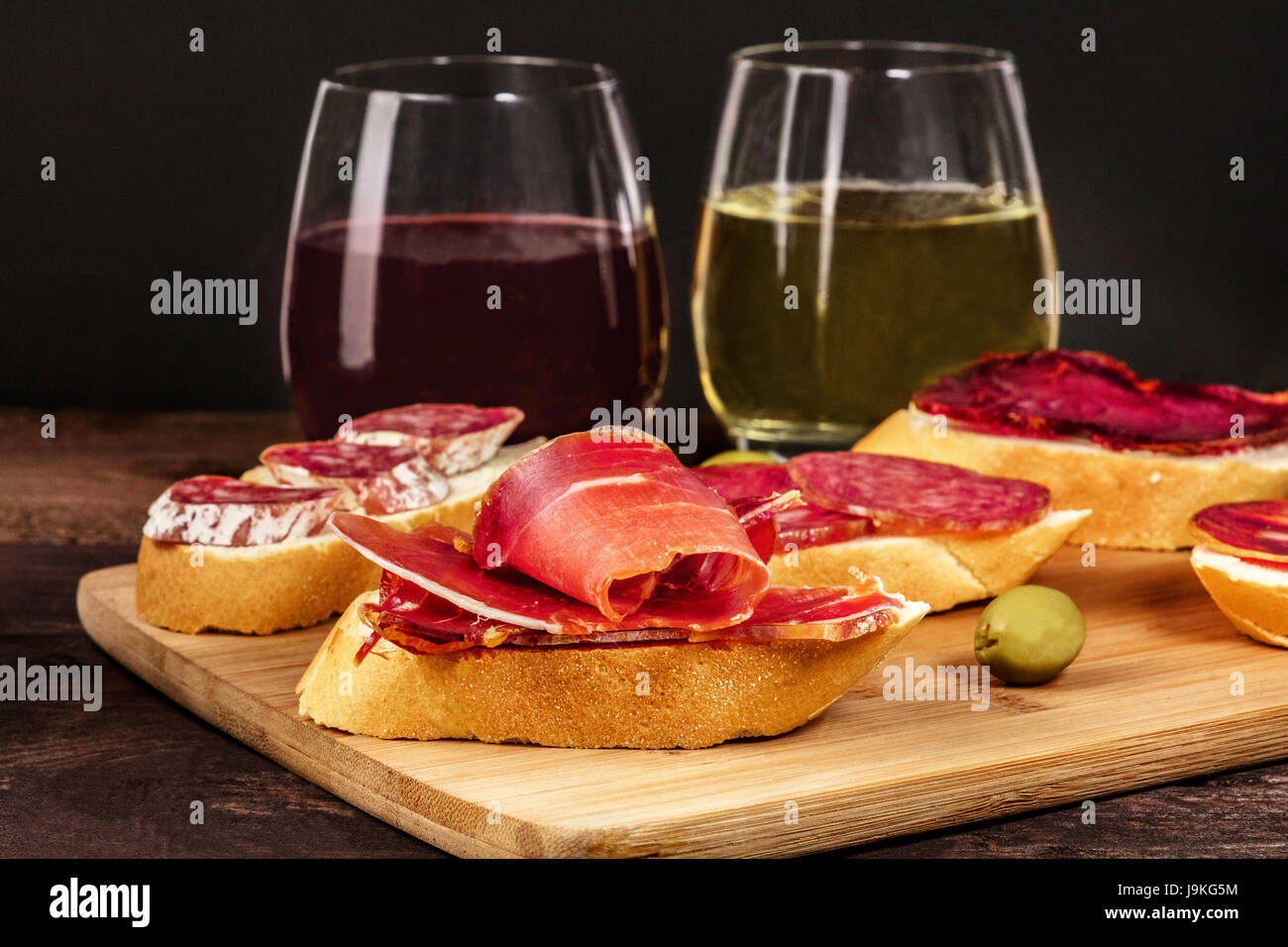 A photo of embutidos tapas, sandwiches with jamon, salchichon, lomo ...