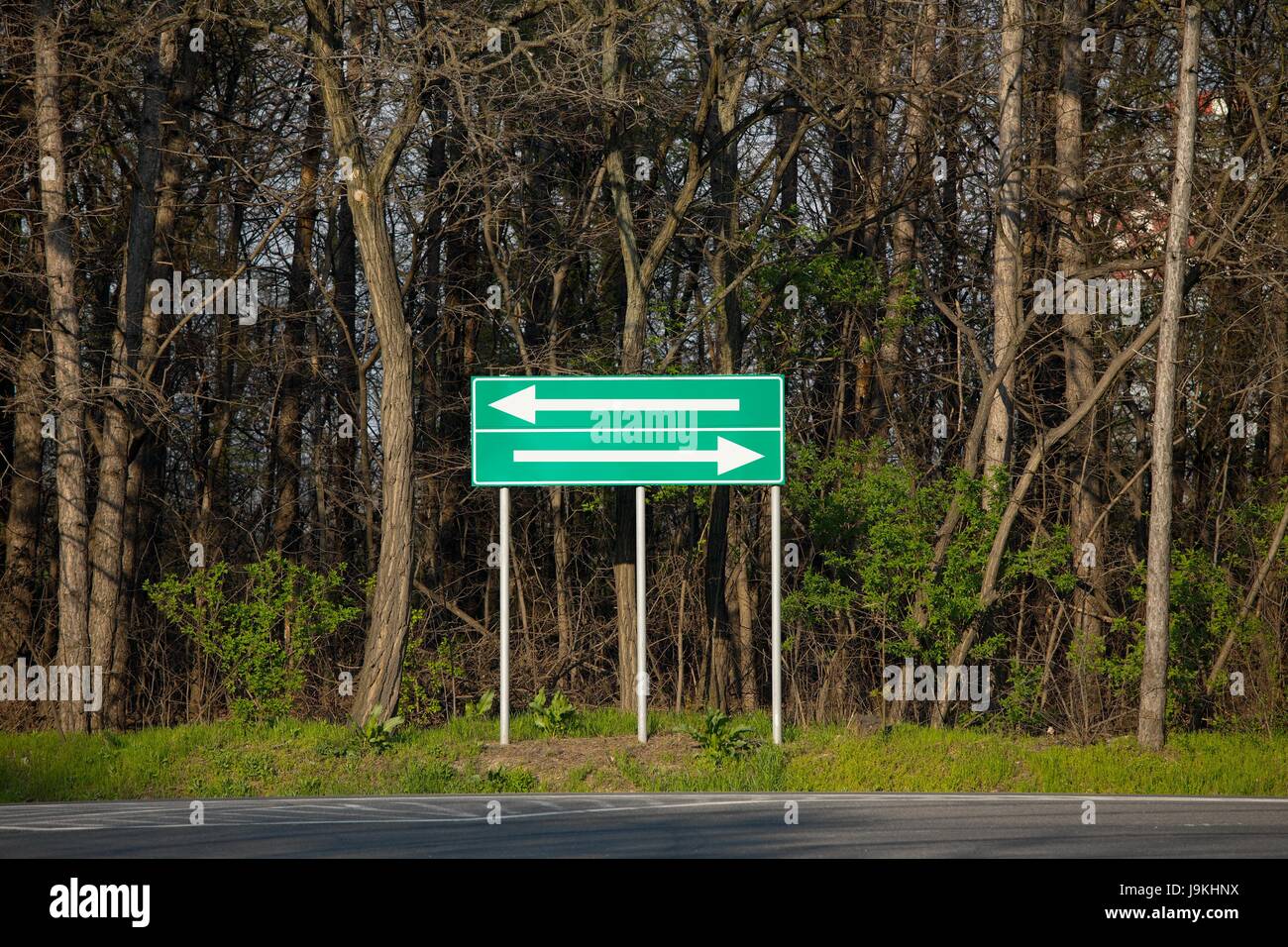 Roadside directional sign tree trees hi-res stock photography and ...